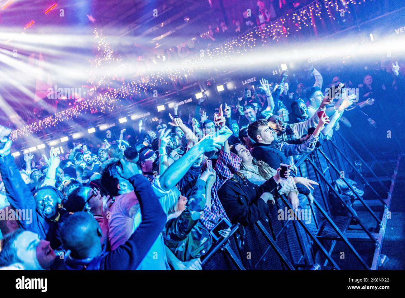 Happy excited fans having fun during a pop music festival under the ...