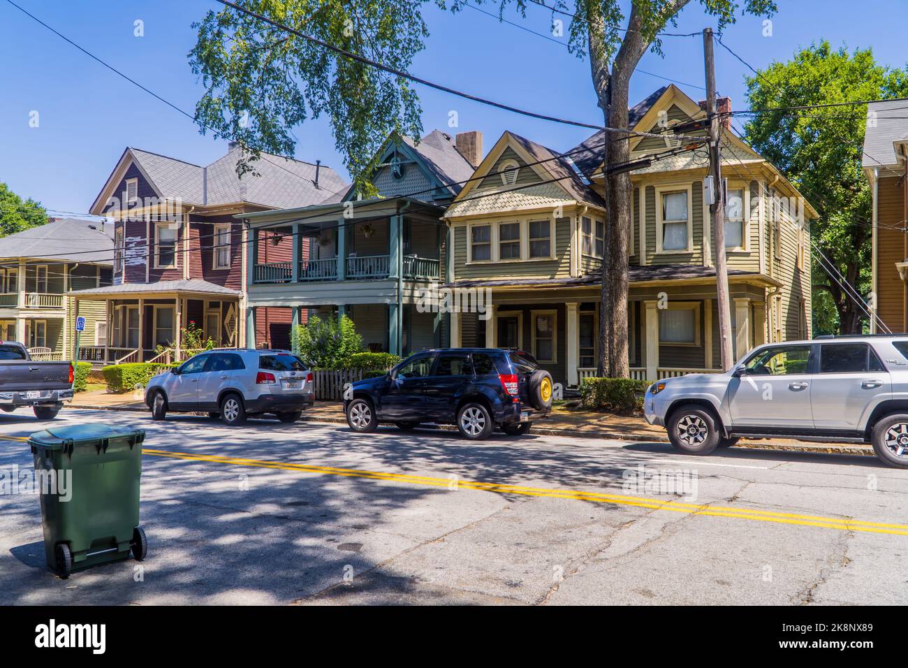 A beautiful street with cars and historic houses in Old Fourth Ward ...