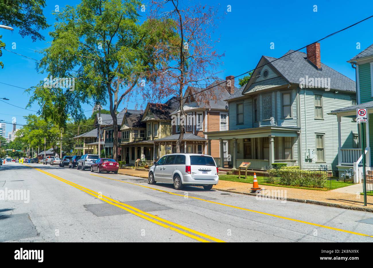 A beautiful street with cars and historic houses in Old Fourth Ward ...