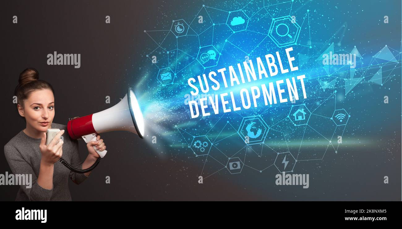 Young woman shouting in megaphone, technology announcement concept ...