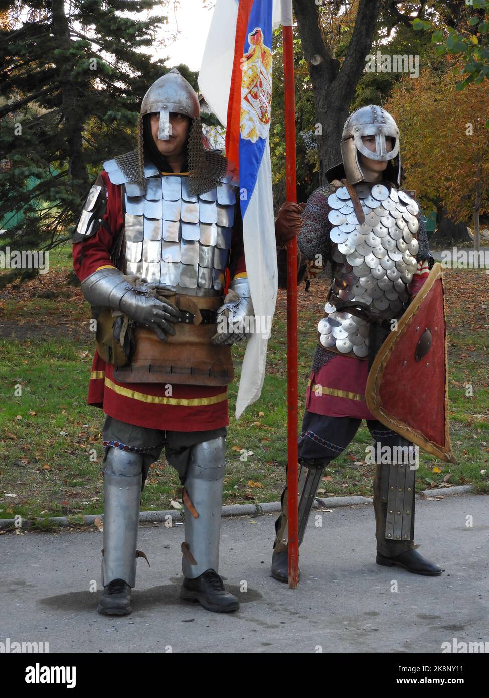 Two men dressed in medieval costumes in the park Stock Photo - Alamy