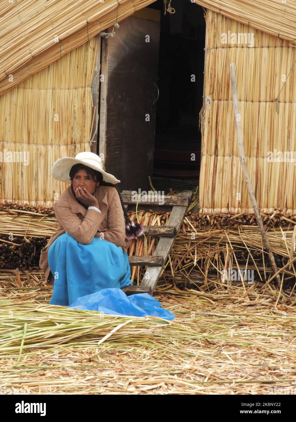 Indigenous women at Uros floating islands in Lake Titicaca in Peru ...