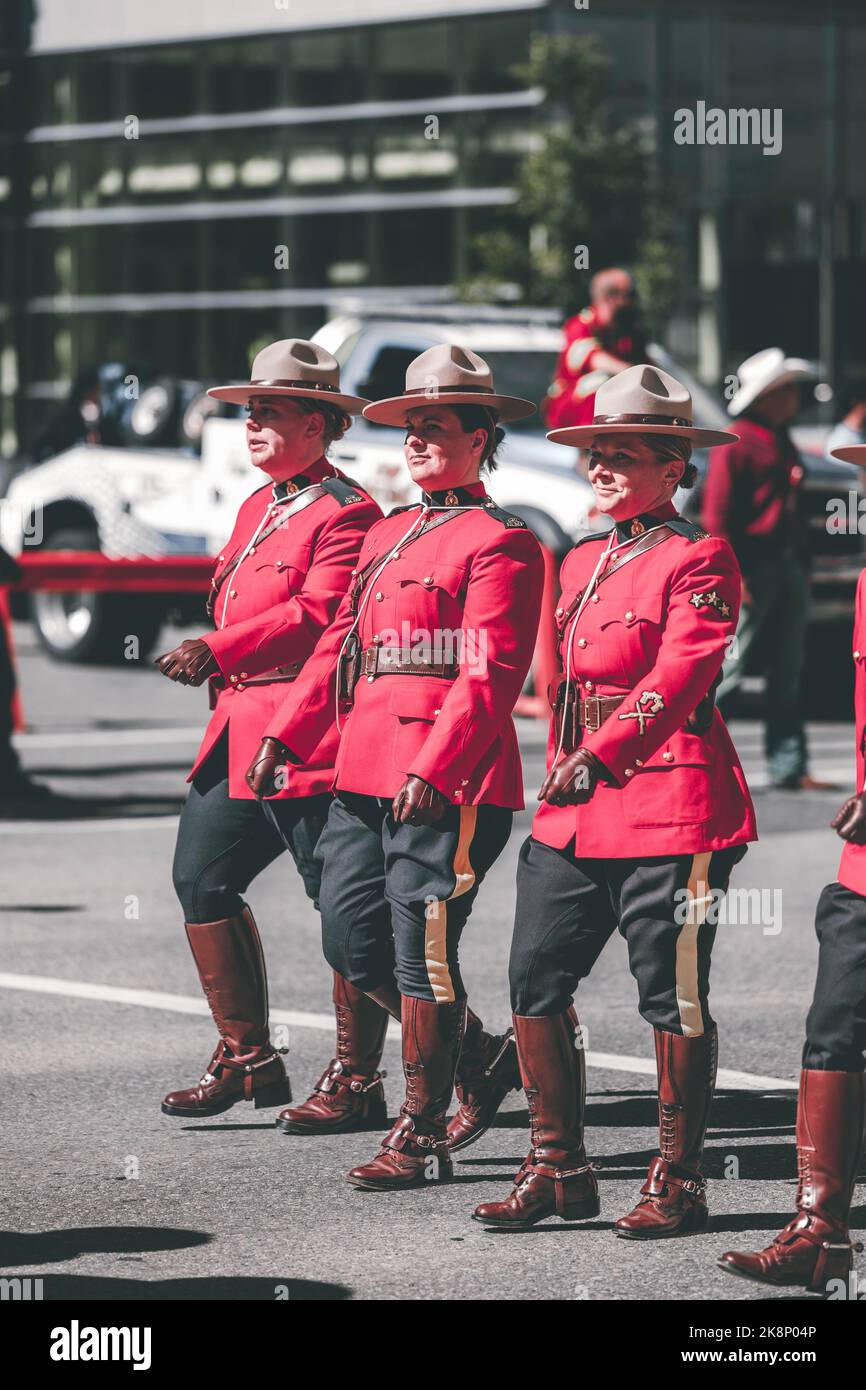 A vertical view of three female RCMP officers at the Calgary Stampede ...