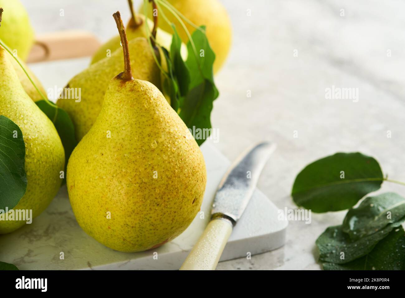 Pears. Fresh sweet organic pears with leaves on stand or plate on old ...