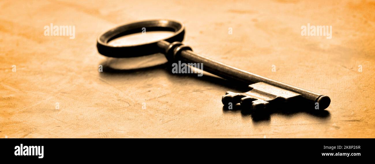 Old key laying on top of worn wood Stock Photo - Alamy