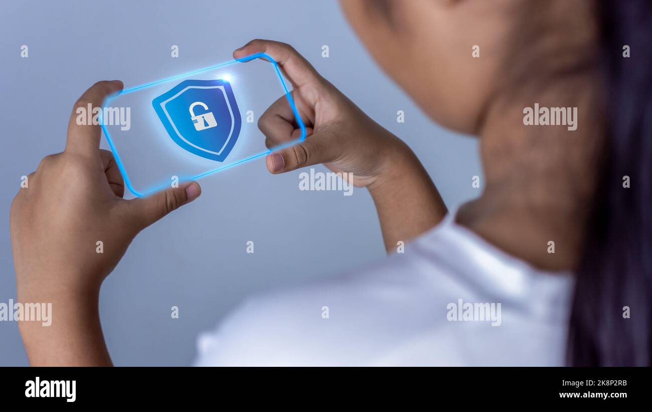 Woman holding phone tablet screen with protection icon. Represents ...