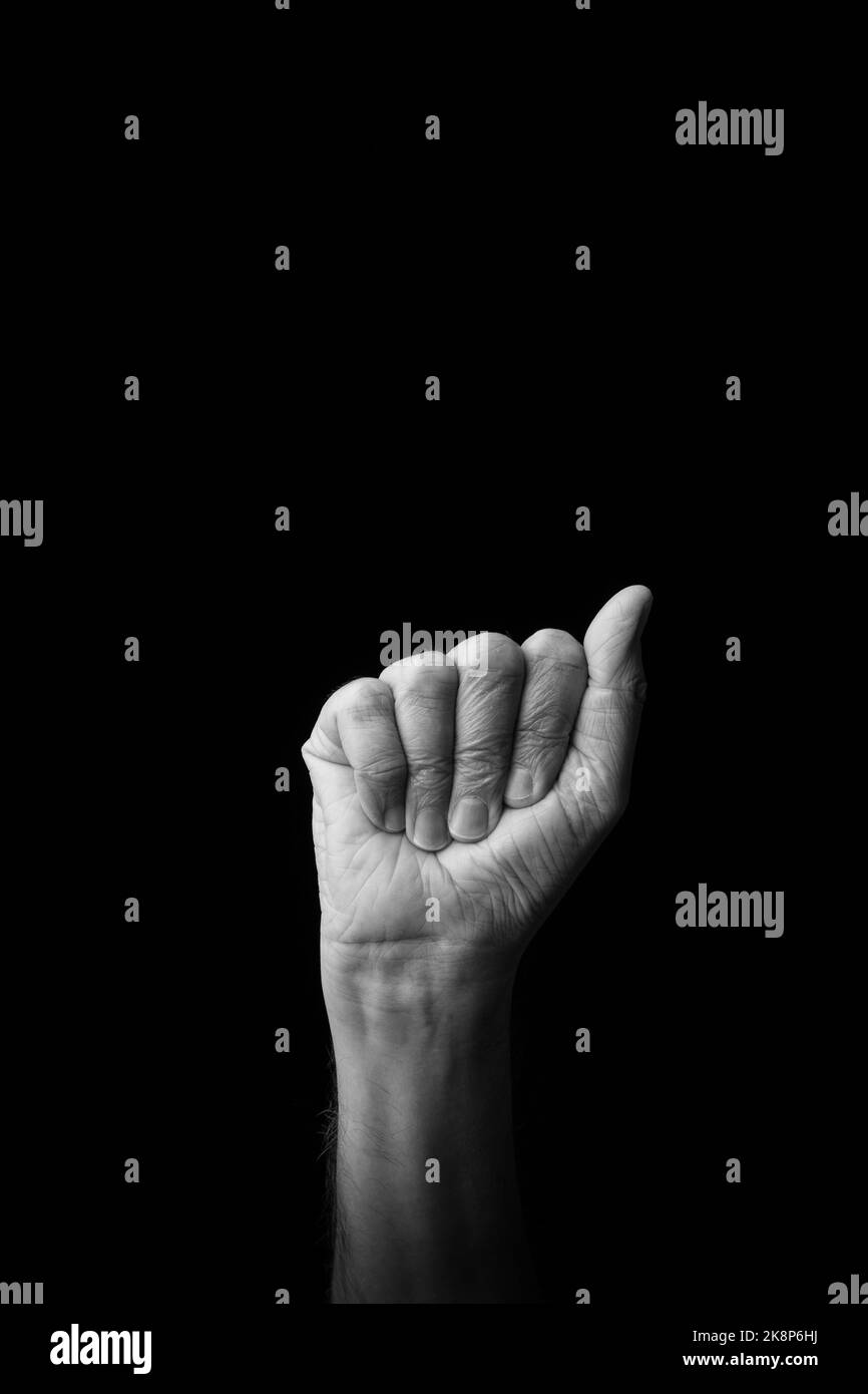 Dramatic black and white image of a male hand fingerspelling the ...