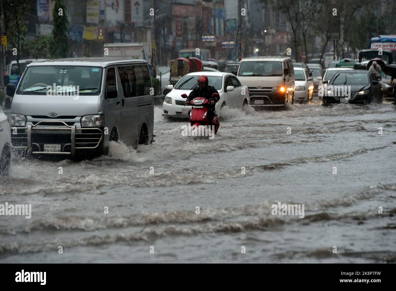 Dhaka 24th Oct 2022 Vehicles Pass Through A Waterlogged Street In dhaka-24th-oct-2022-vehicles-pass-through-a-waterlogged-street-in