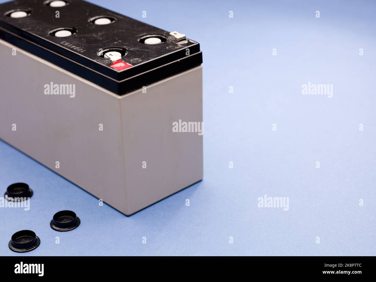 battery maintenance concept, red and black connection pins with battery ...