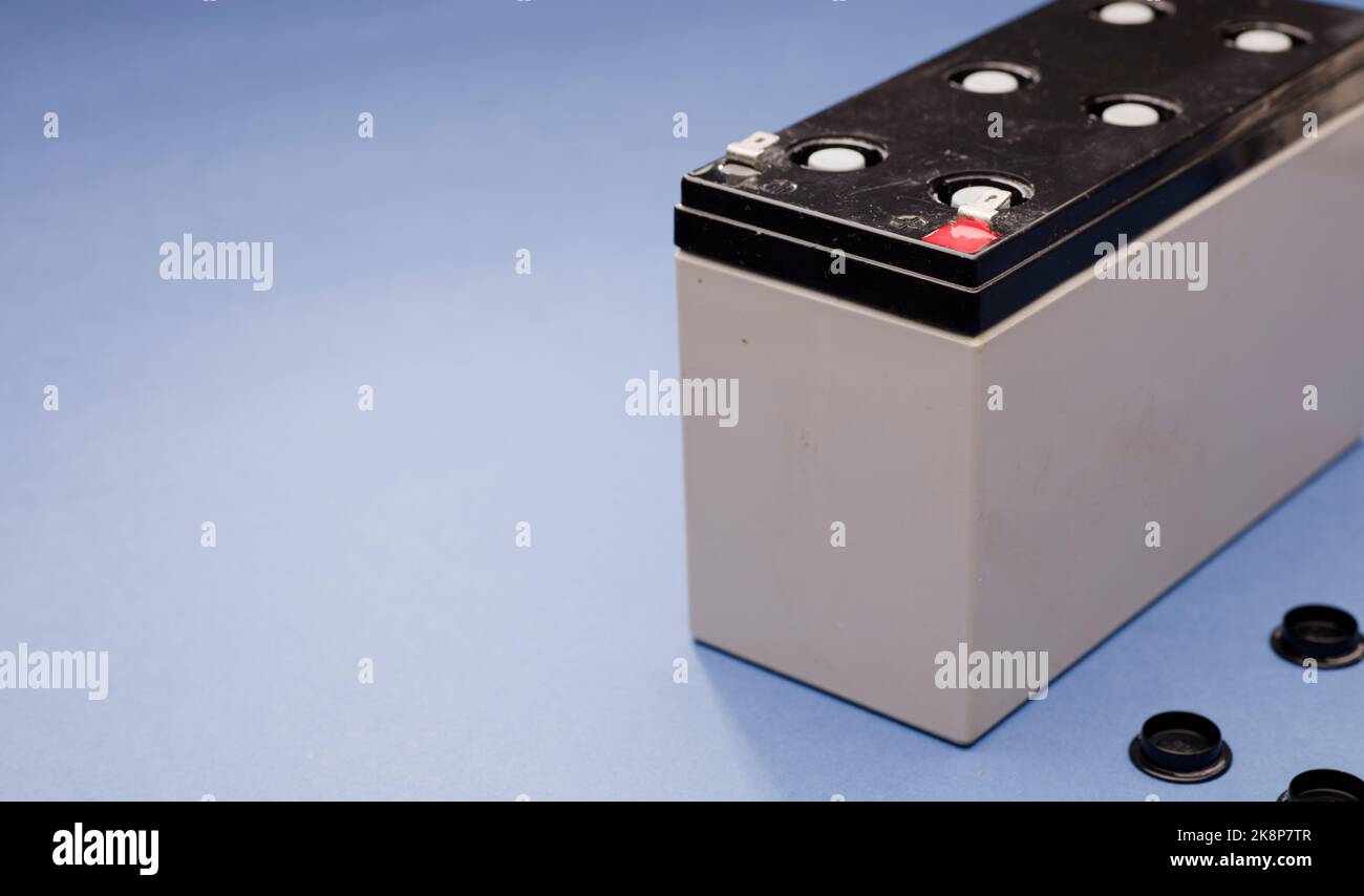 battery maintenance concept, red and black connection pins with battery ...