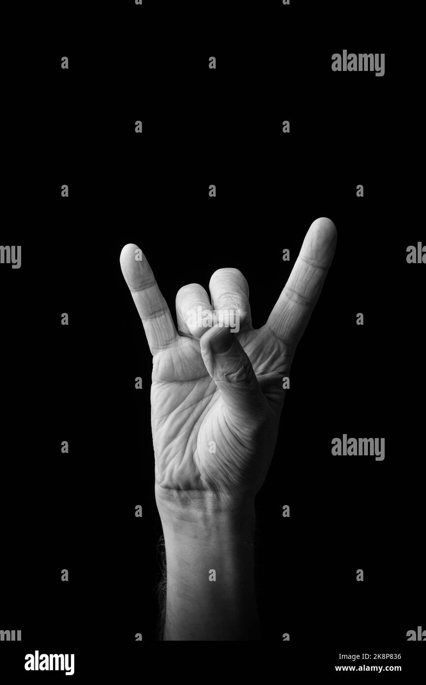 Dramatic black and white image of a male hand fingerspelling the ...