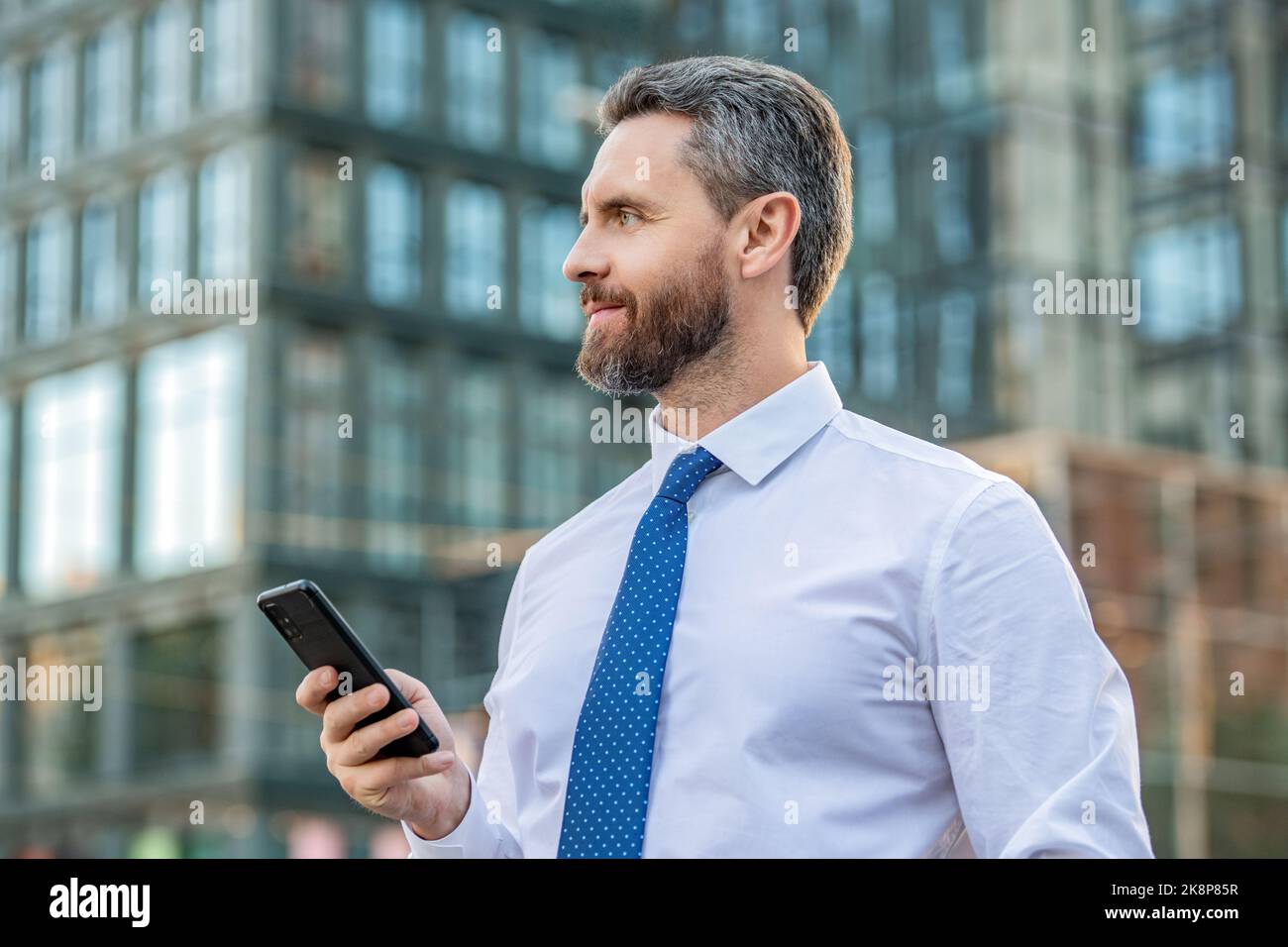 phone communication of smiling businessman. businessman with phone has ...