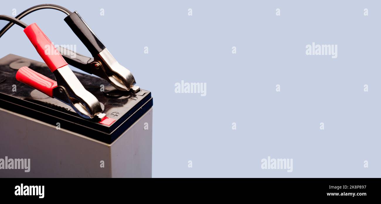 connected bolts charging positive pole and negative pole of battery ...