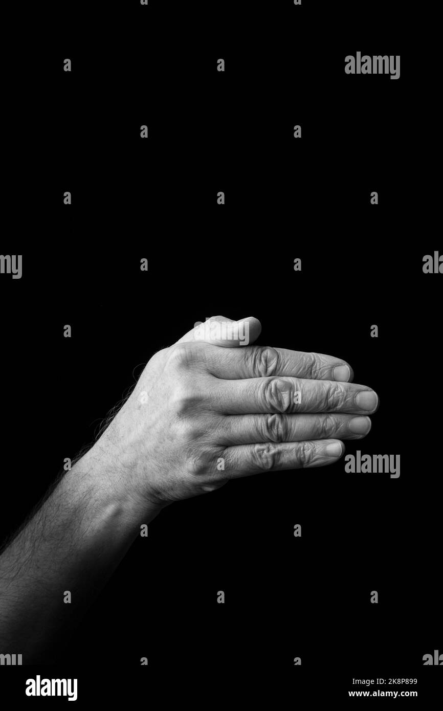 Dramatic black and white image of a male hand fingerspelling the ...