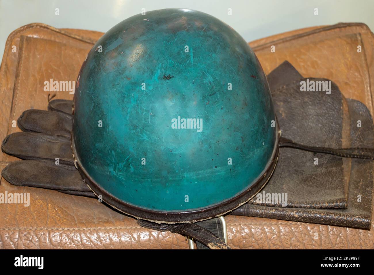 Old motorcycle helmet with gloves Stock Photo - Alamy