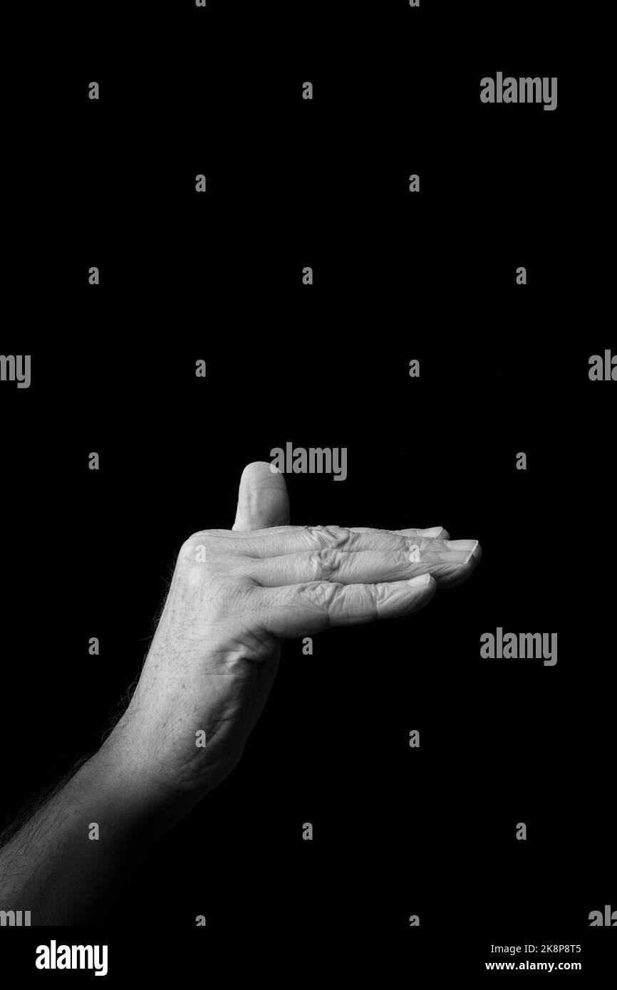 Dramatic black and white image of a male hand fingerspelling the ...
