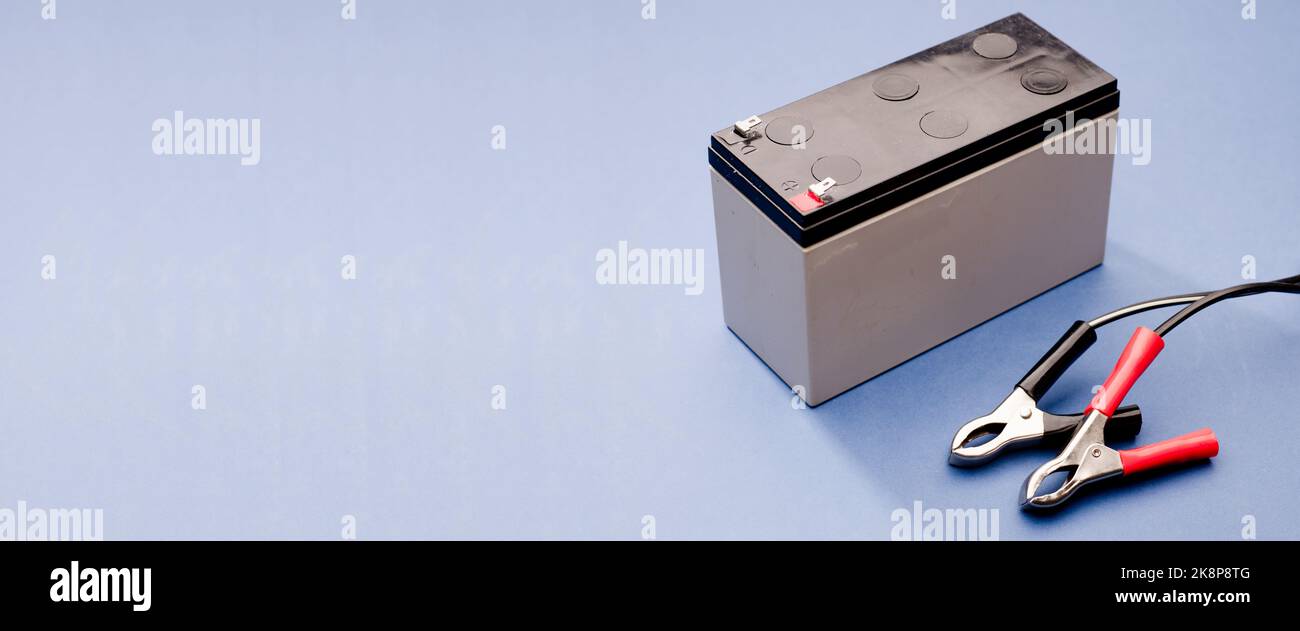 red and black connection pins with battery positive pole and negative ...