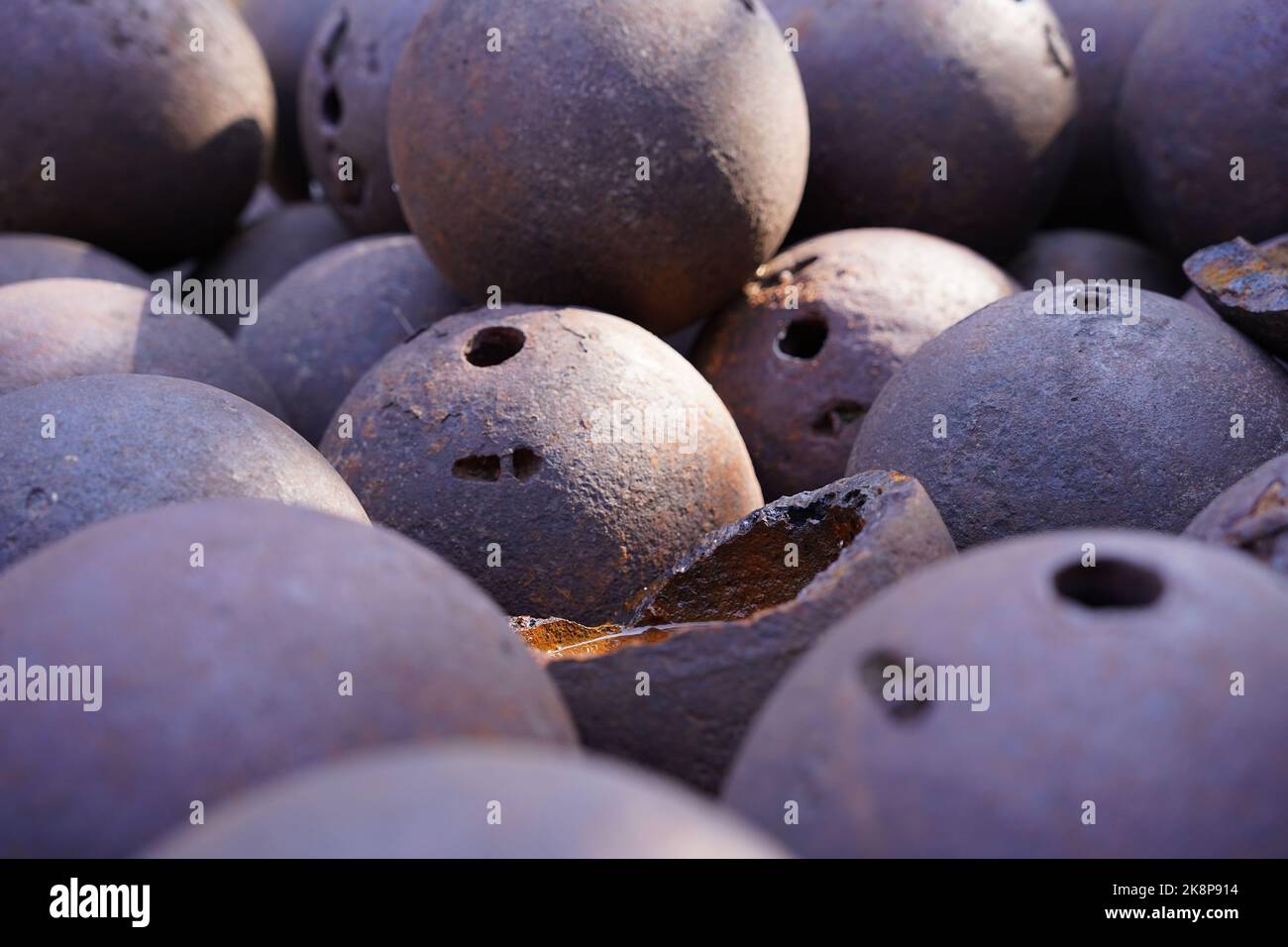 A pile of old rusty metal cannonballs Stock Photo - Alamy