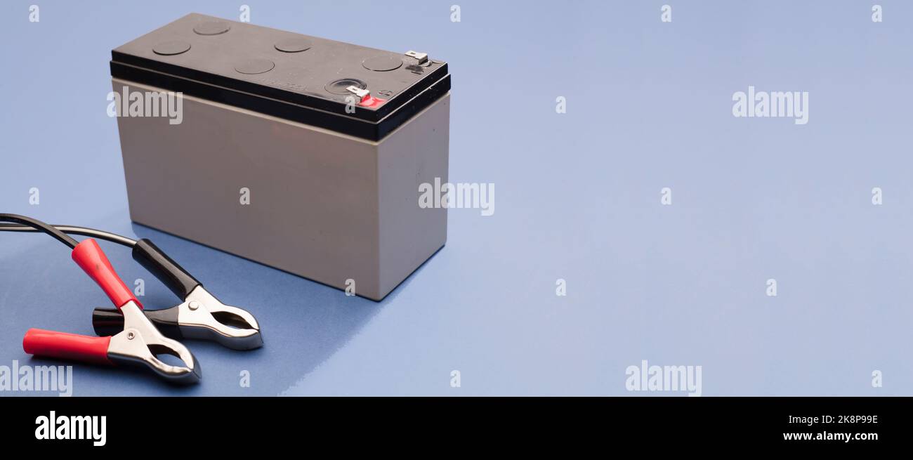 red and black connection pins with battery positive pole and negative ...