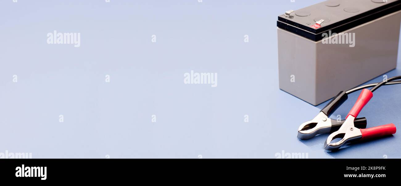 red and black connection pins with battery positive pole and negative ...