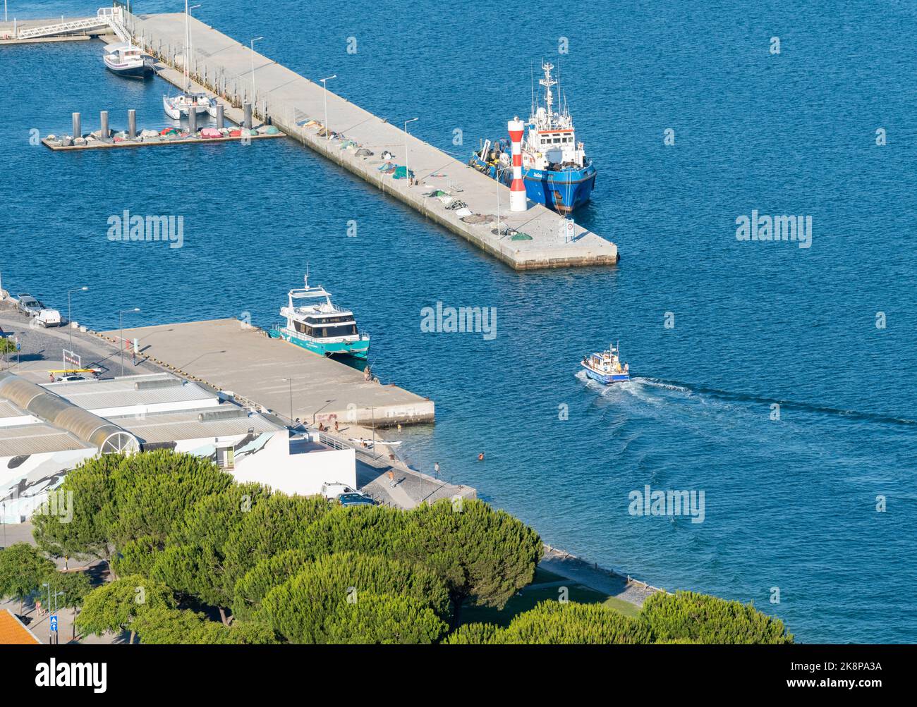 An aerial view of fishing boats by the port in Setubal, Portugal with ...