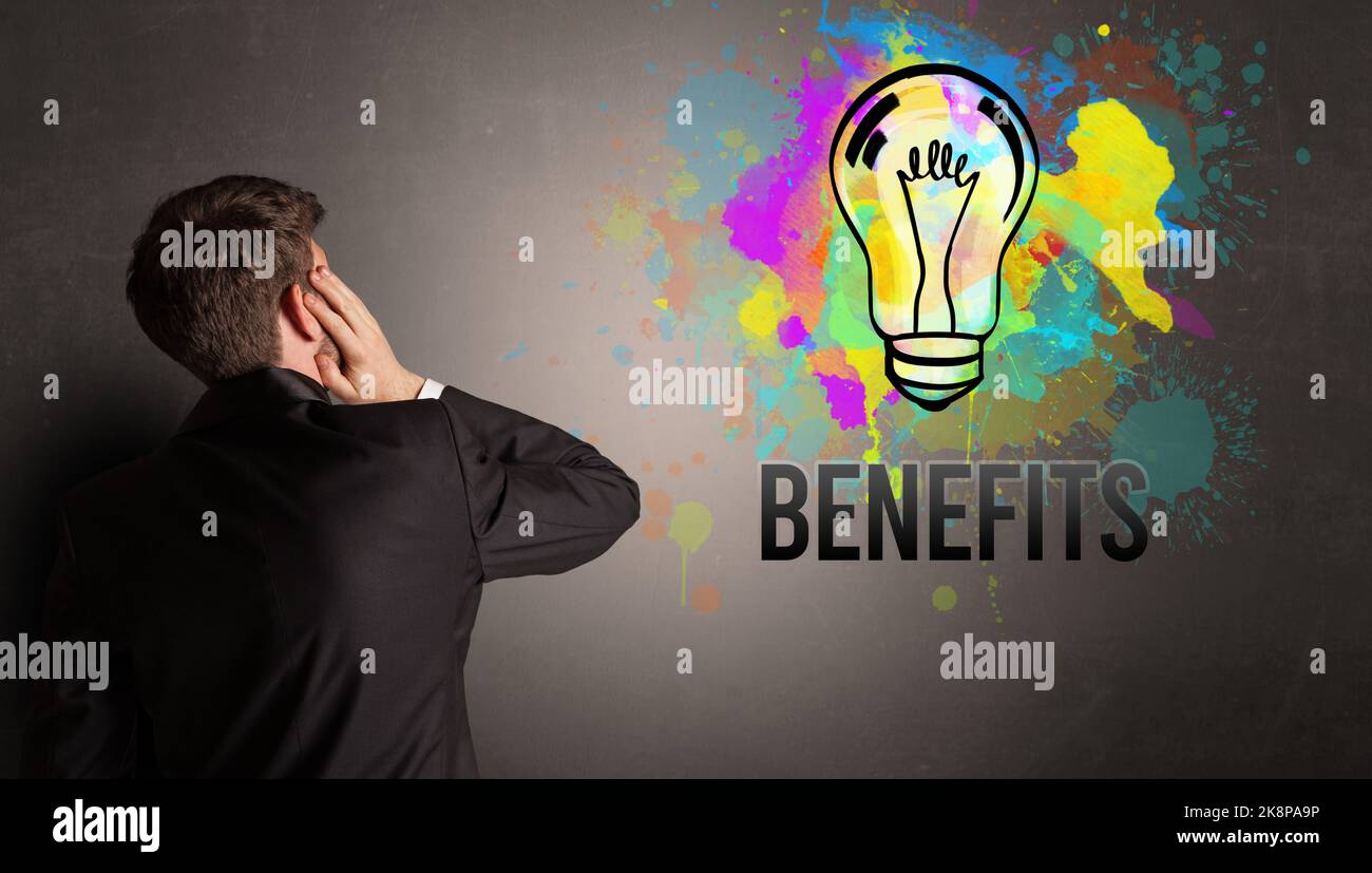 businessman drawing colorful light bulb Stock Photo - Alamy