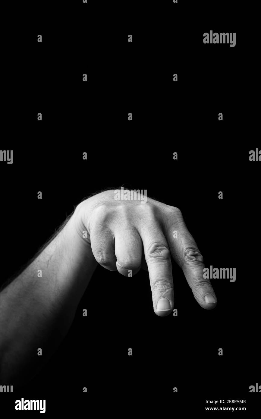 Dramatic black and white image of a male hand fingerspelling the ...
