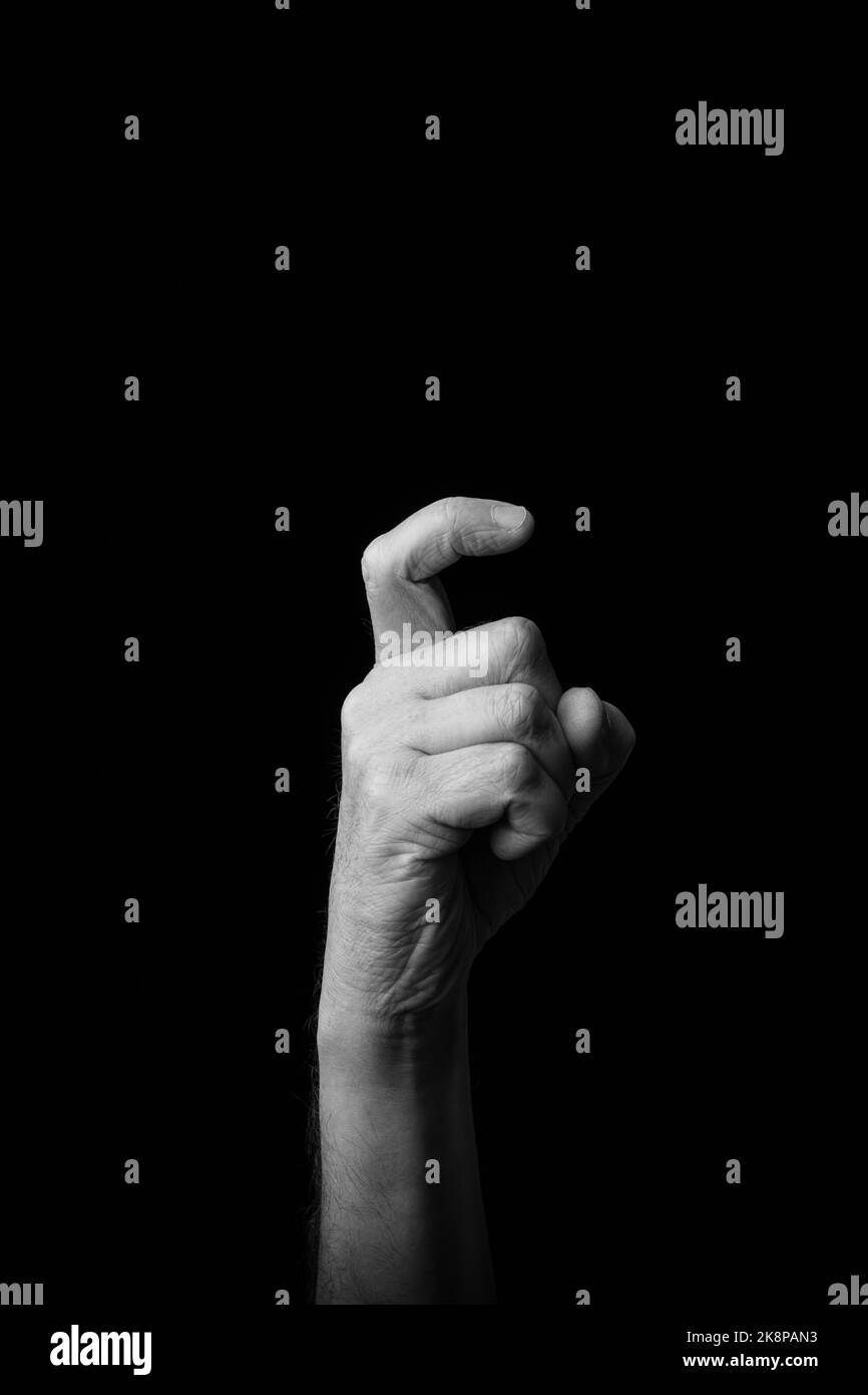 Dramatic black and white image of a male hand fingerspelling the ...