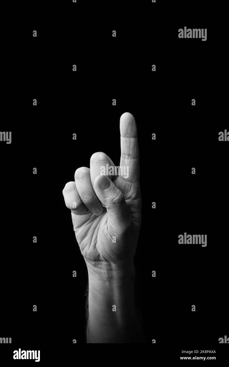 Dramatic black and white image of a male hand fingerspelling the ...
