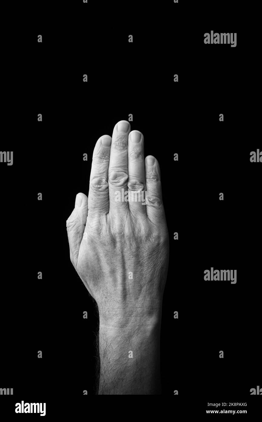 Dramatic black and white image of a male hand fingerspelling the ...