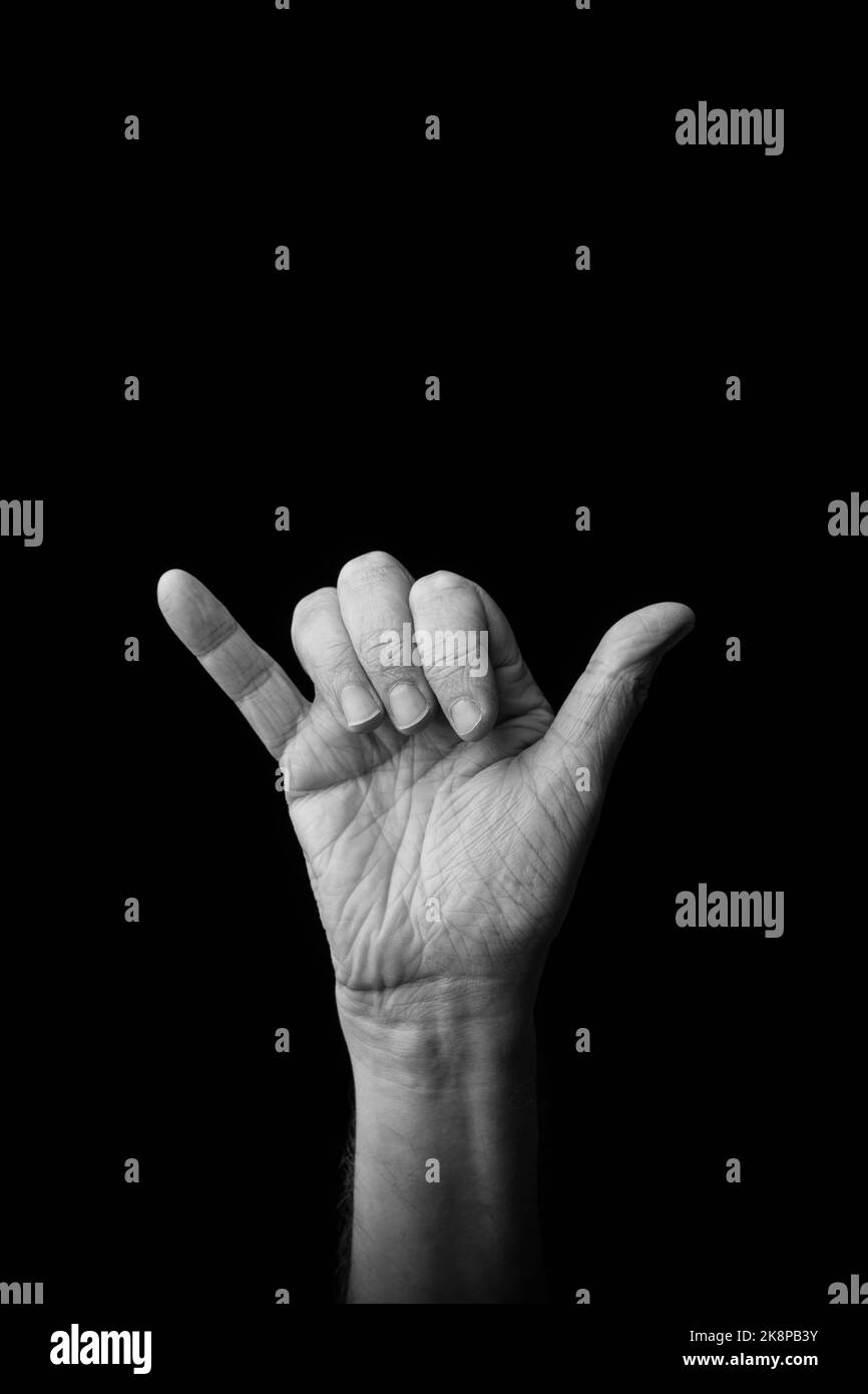 Dramatic black and white image of a male hand fingerspelling the ...