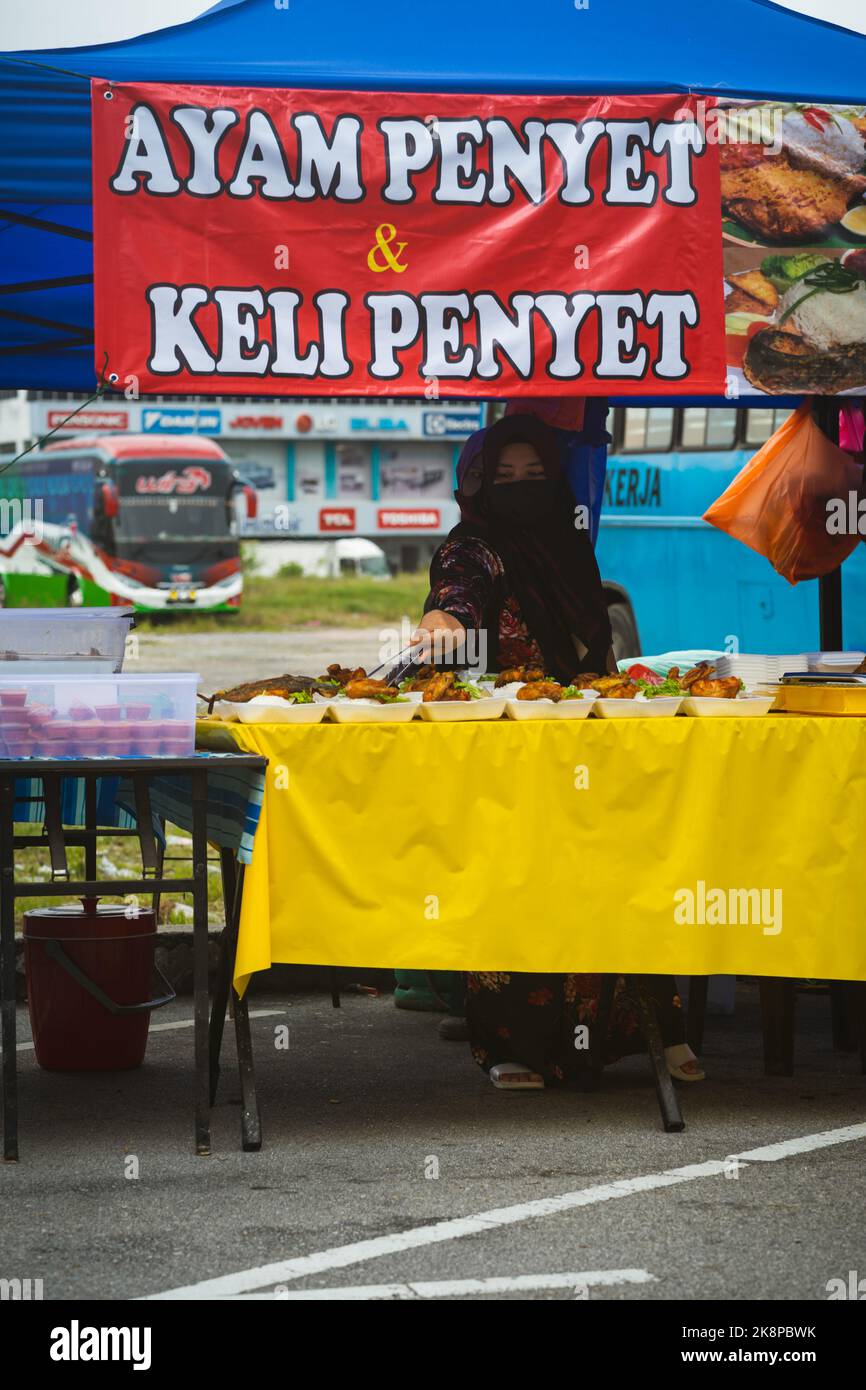A street stall selling Ayam Penyet, an East Javanese cuisine smashed ...