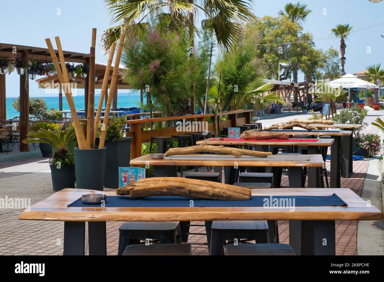 An aerial view of cafe bar in a beach town in Greece Stock Photo - Alamy