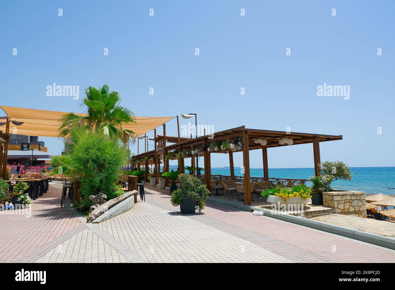 An aerial view of cafe bar in a beach town in Greece Stock Photo - Alamy