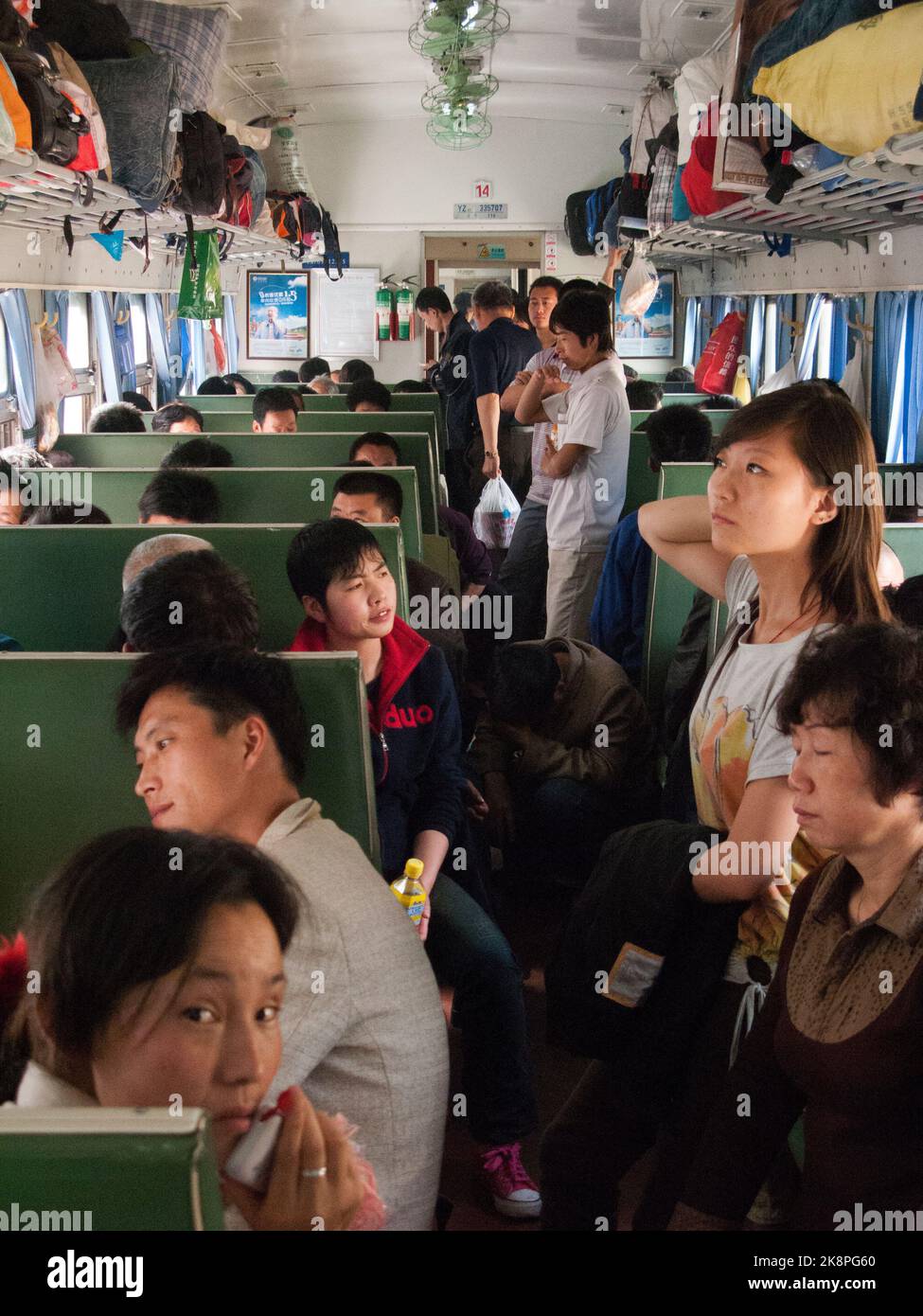 Railway train passengers in a passenger train carriage, on a journey to ...