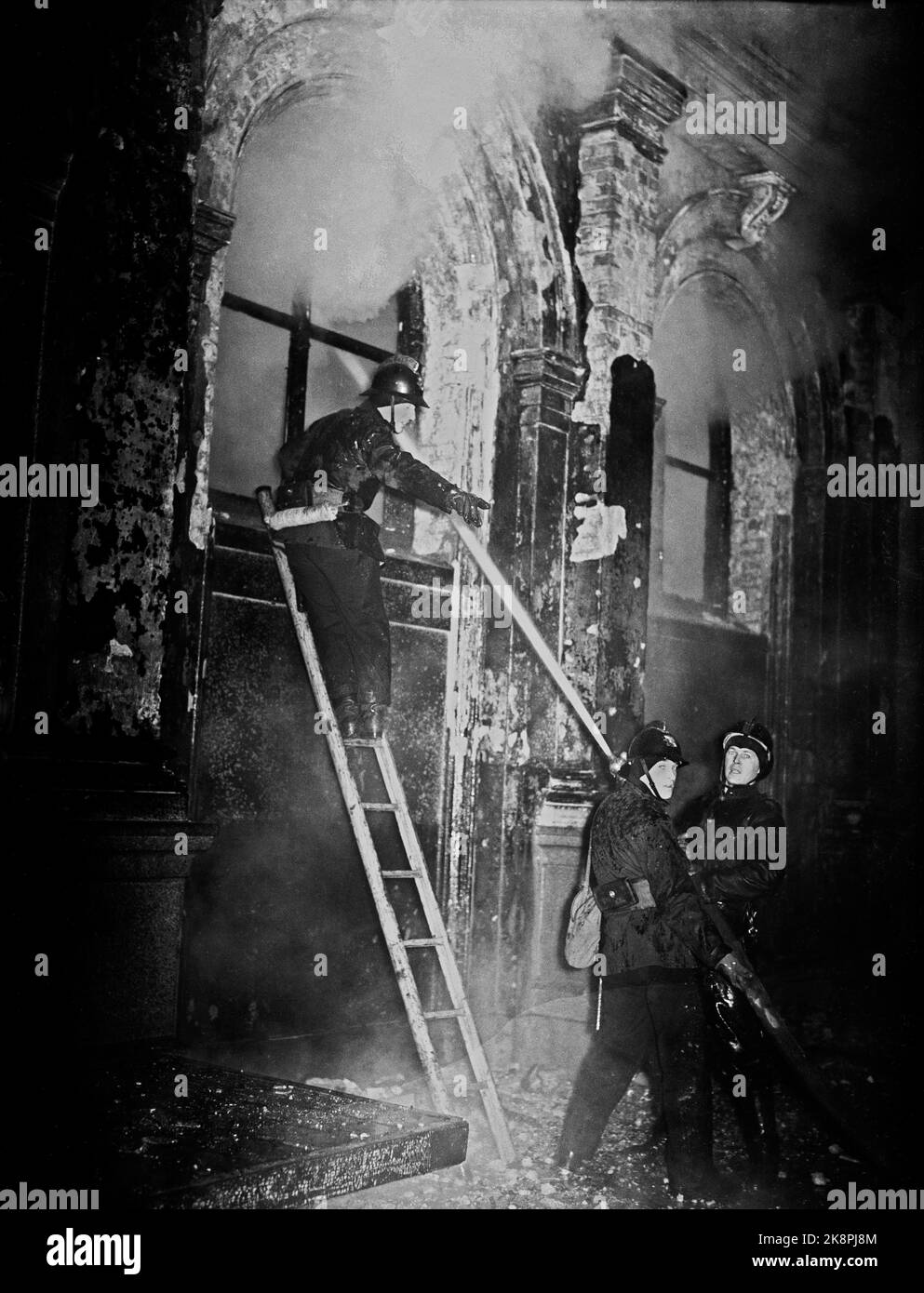 1942 fire crews in work on the fire extinguisher photo hi-res stock ...