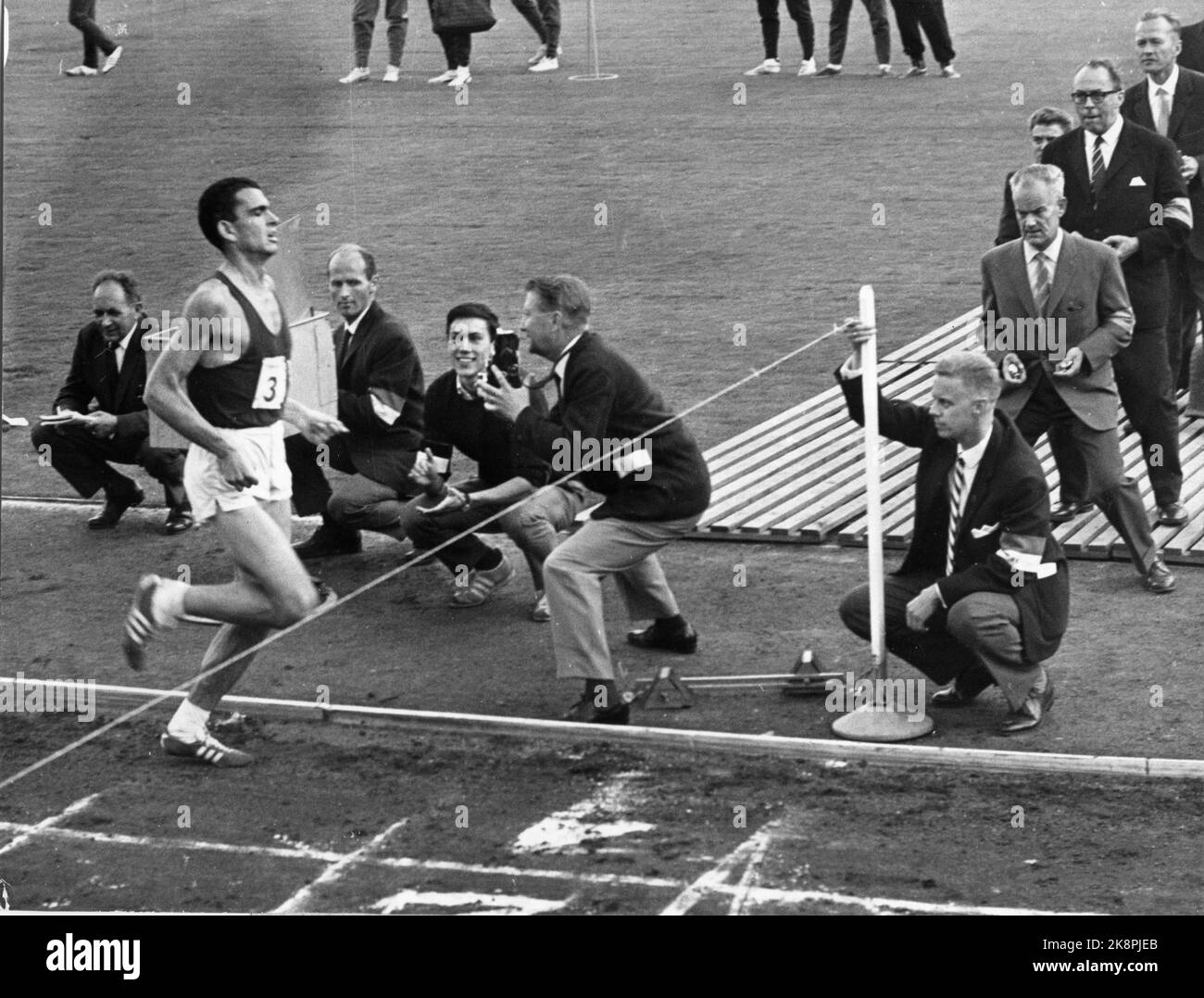Oslo 19650714. Athletics: Australian Ron Clarke crosses the finish line ...