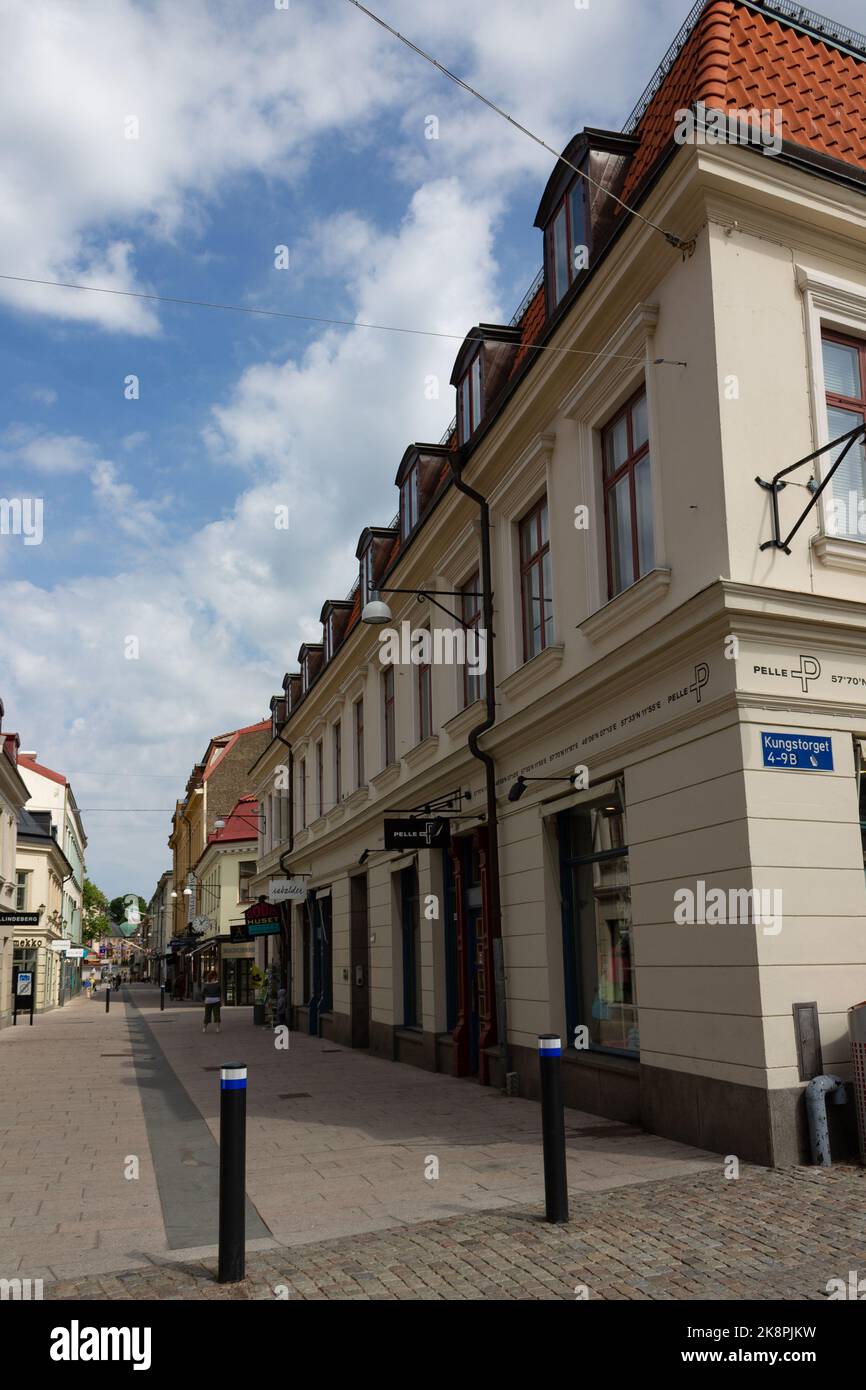 A vertical shot of an alley with historic beautiful buildings in ...