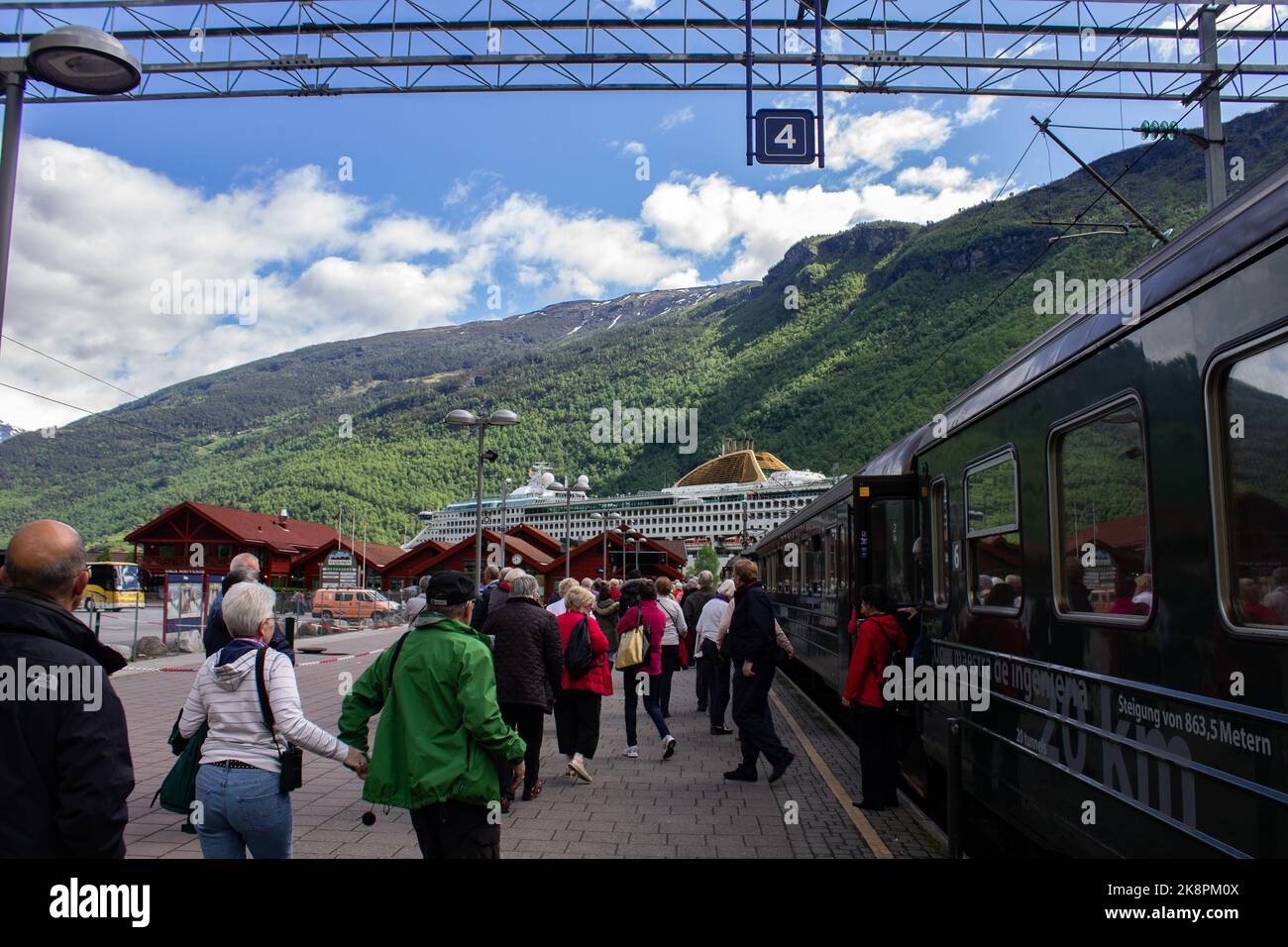 The tourists walking at the train station, near wagons of famous Flamsbana railroad, Flam ...