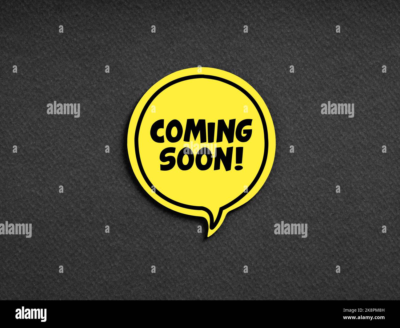 The message coming soon on yellow speech bubble or balloon on black ...