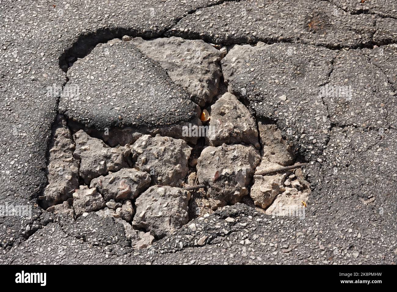 Damaged road surface in Berlin, pothole Stock Photo - Alamy