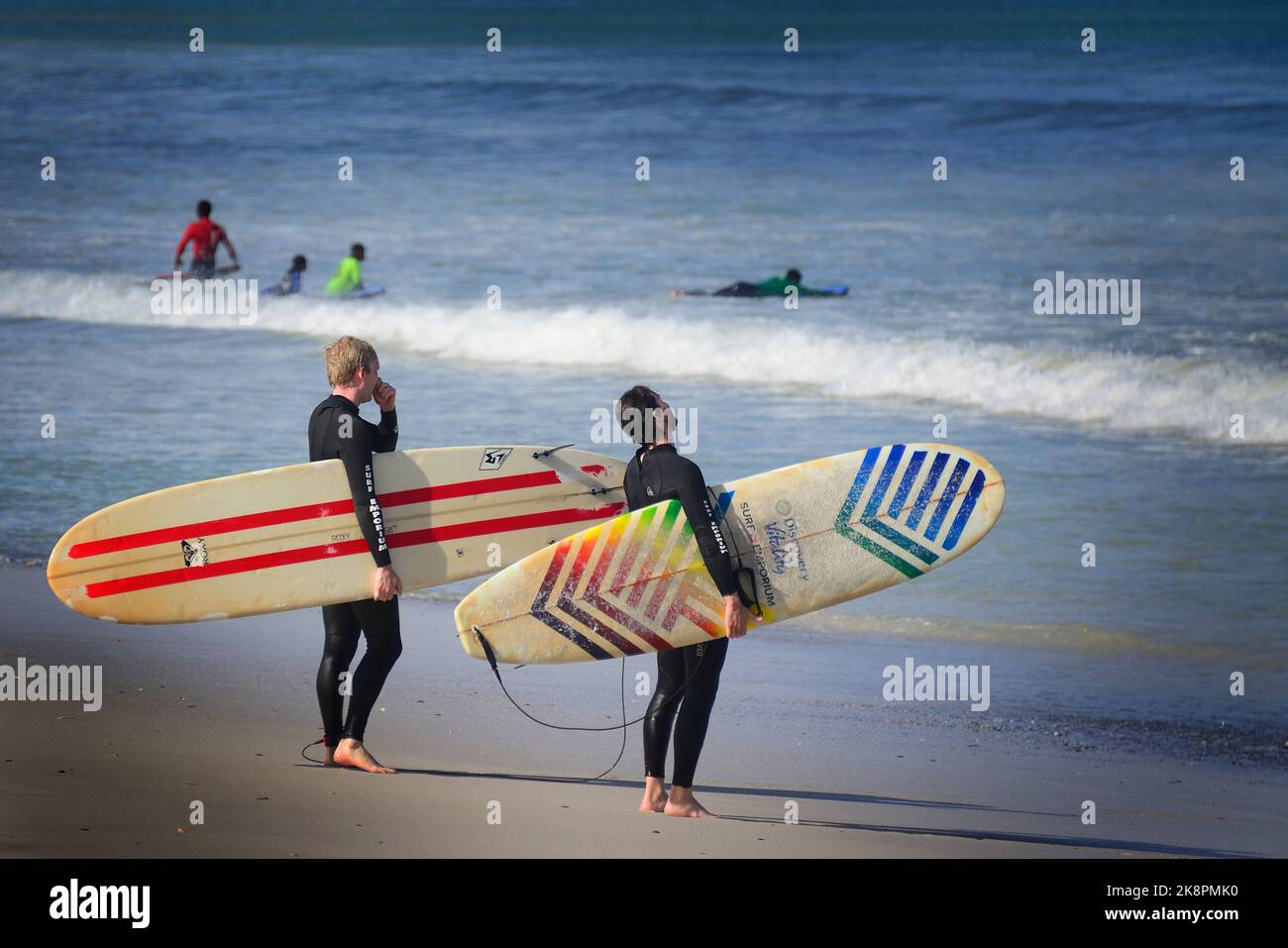 Male Surfers on the beach at the South African seaside resort of ...