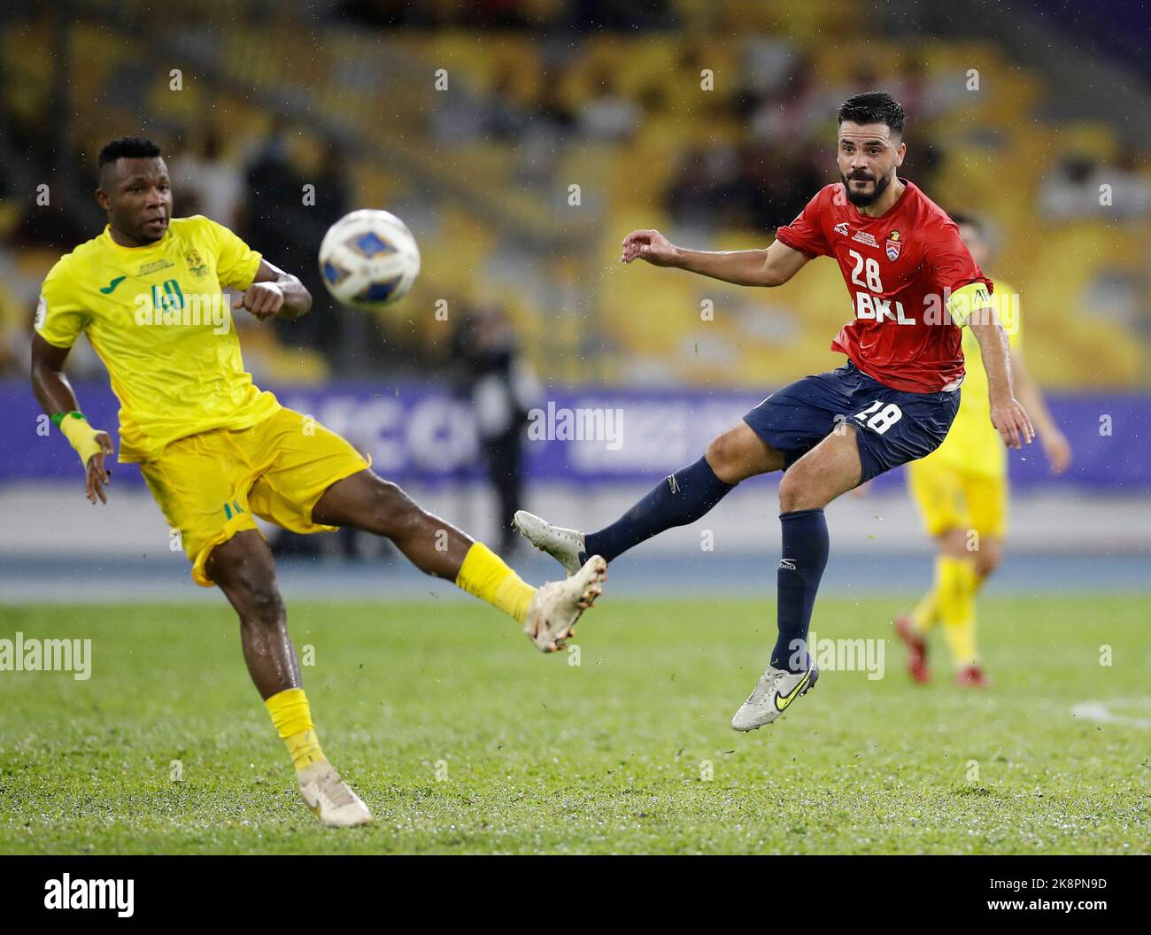 Paulo Josue (R) of Kuala Lumpur City FC and D. Ajibola (L) of AL Seeb ...