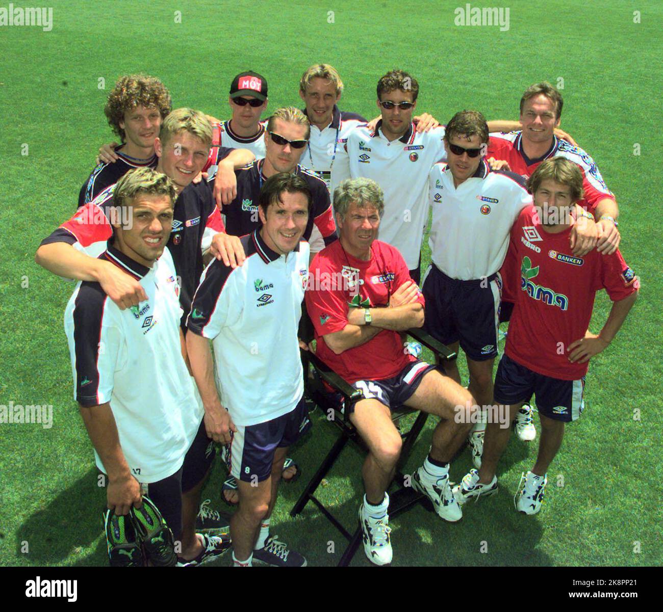 The team to meet Italy on Saturday gathered around the boss sitting on ...