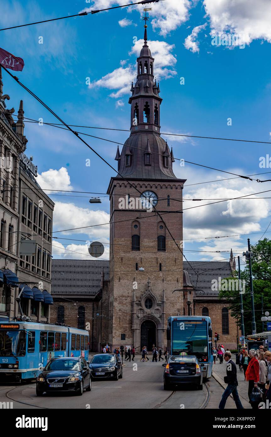 The cathedral clock tower, traffic and and the historical buildings of ...