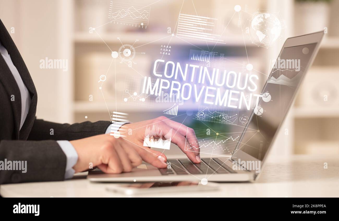 Side view of a business person working on laptop Stock Photo - Alamy