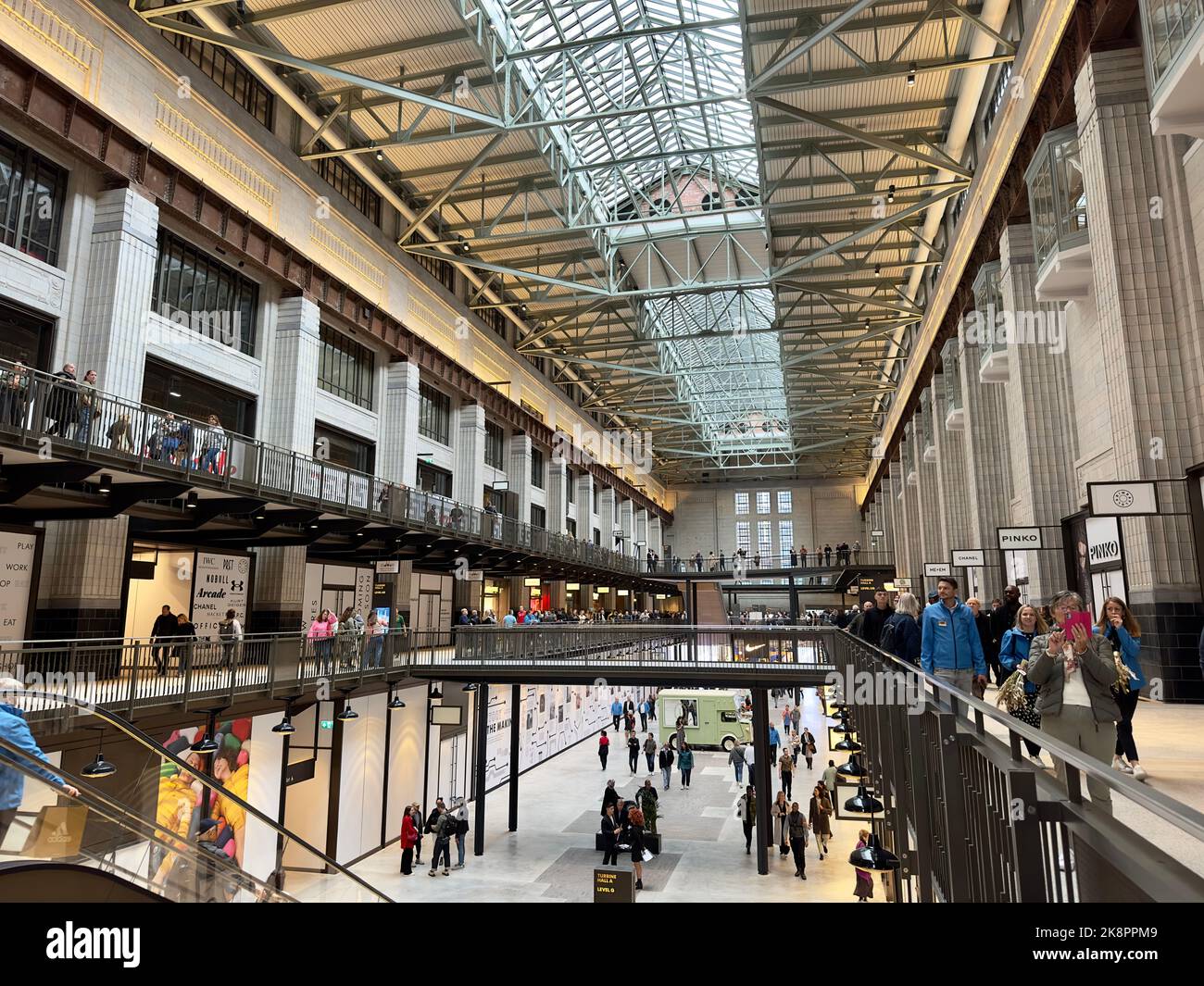 Crowded shopping mall inside the Battersea Power Station in London ...