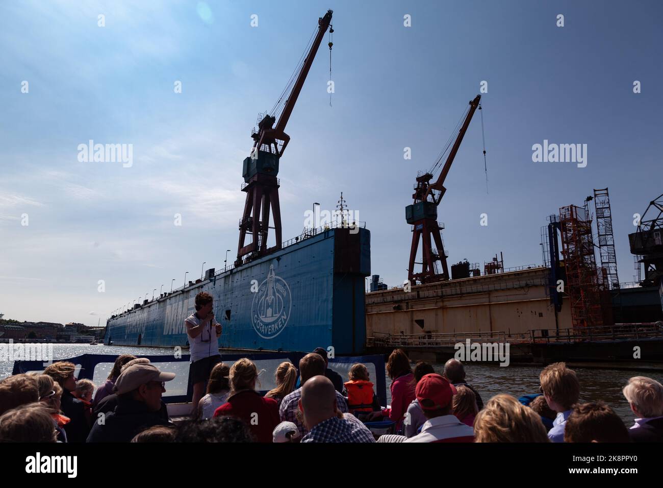 The crowd of people watching the ships and harbor cranes in Gota alv ...