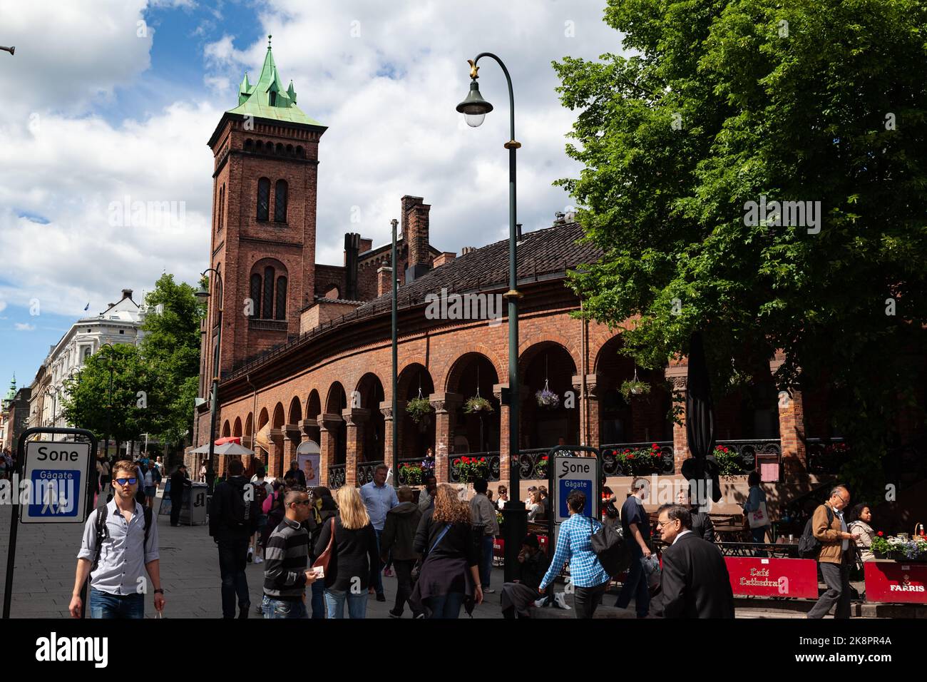 The tourists walking along historical building at Karls Johan gate ...