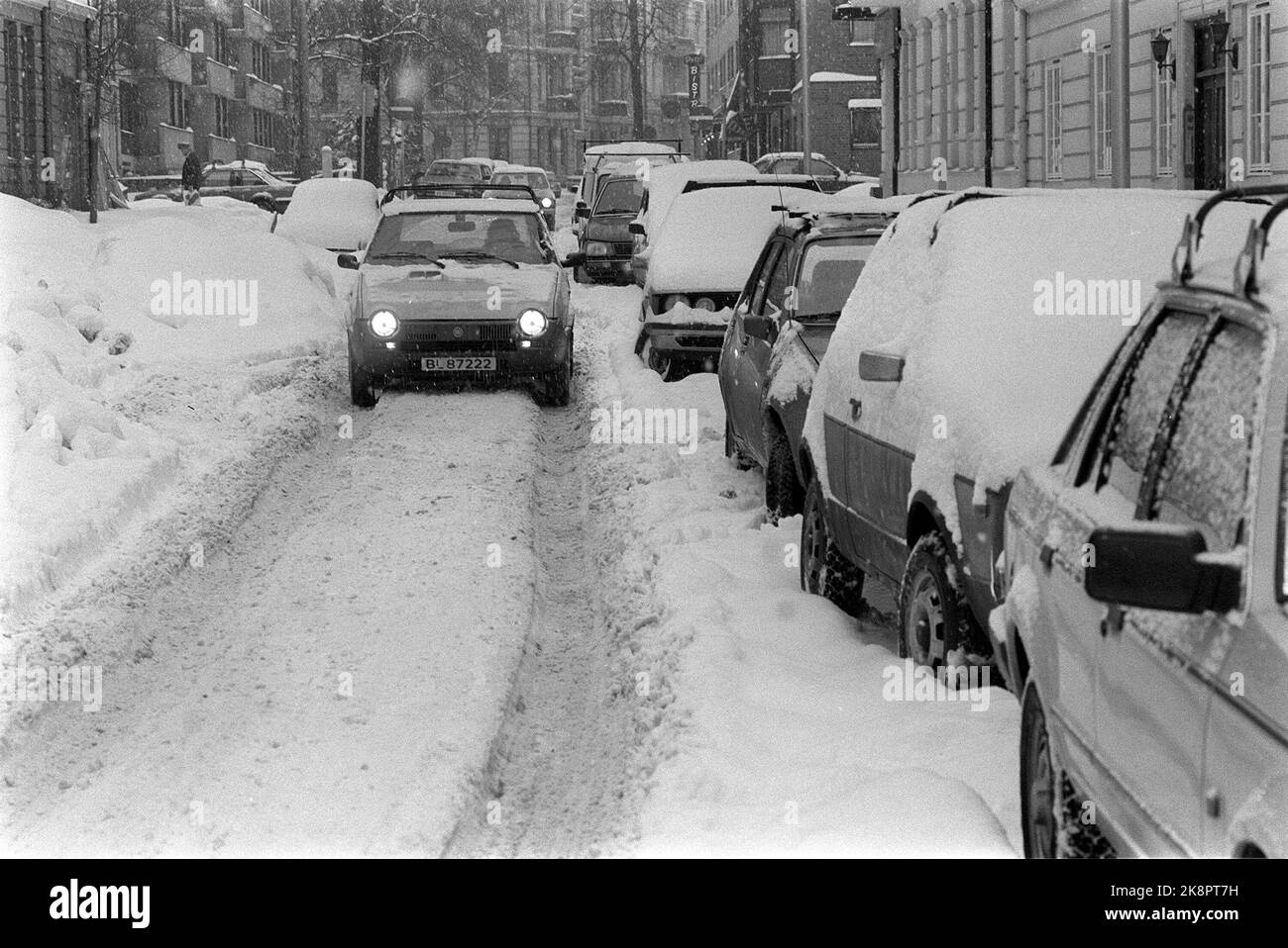 Oslo 19850305: Winter in Oslo. Street with snow, tall brewing edges ...